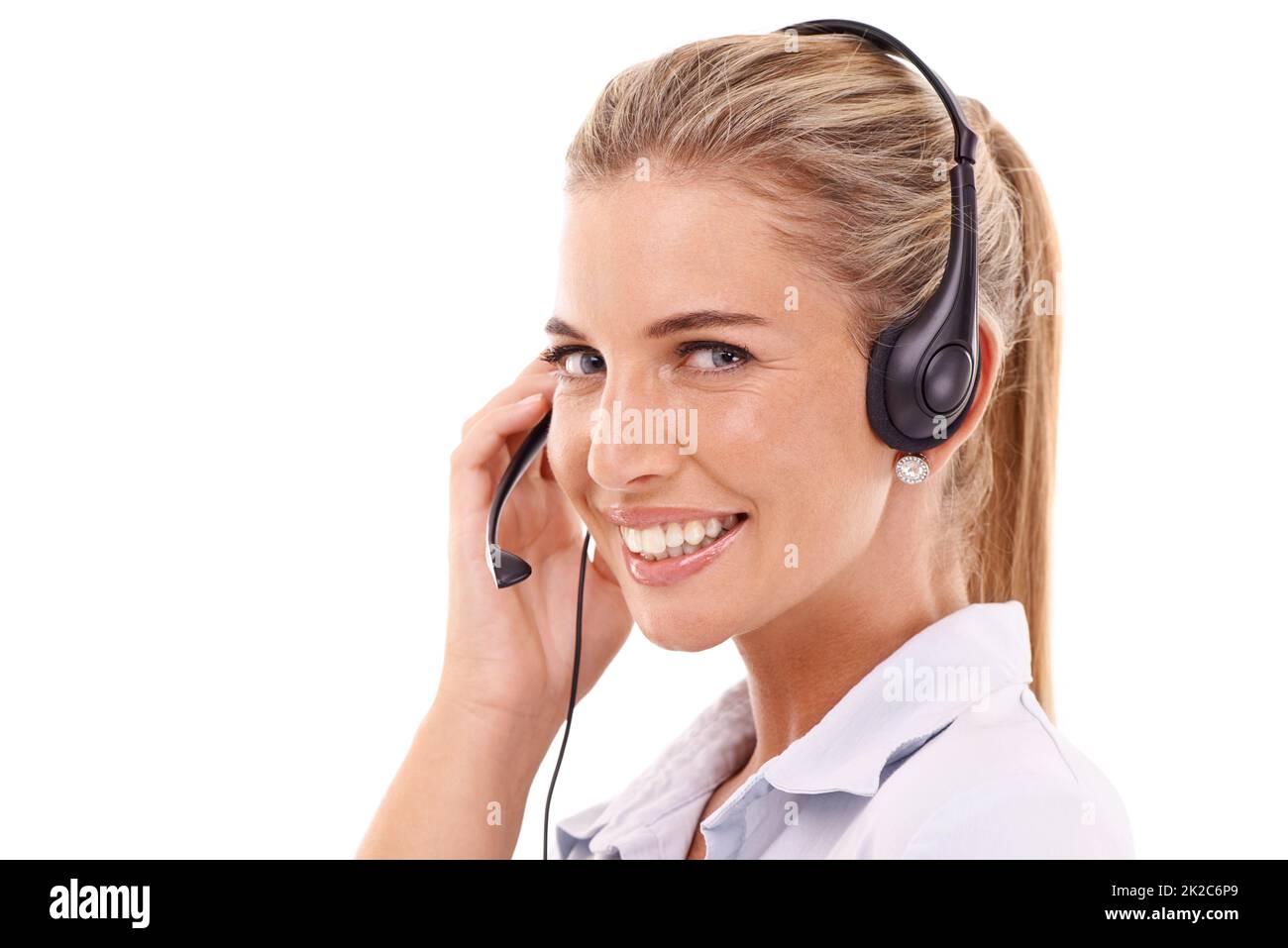How may I help. A call centre operative speaking over her headset while ...