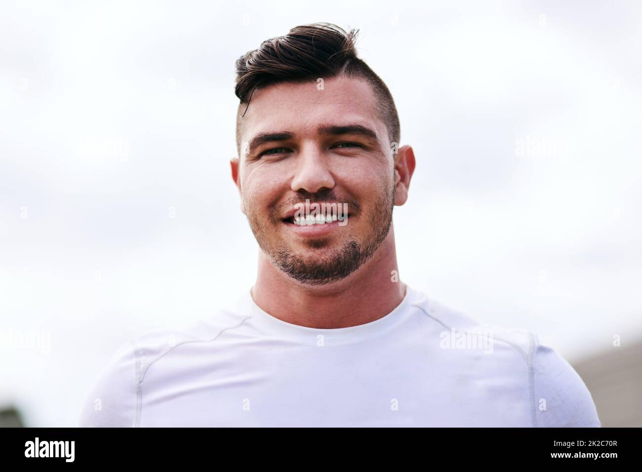 What a great day for a game of rugby. Portrait of a young man playing a ...