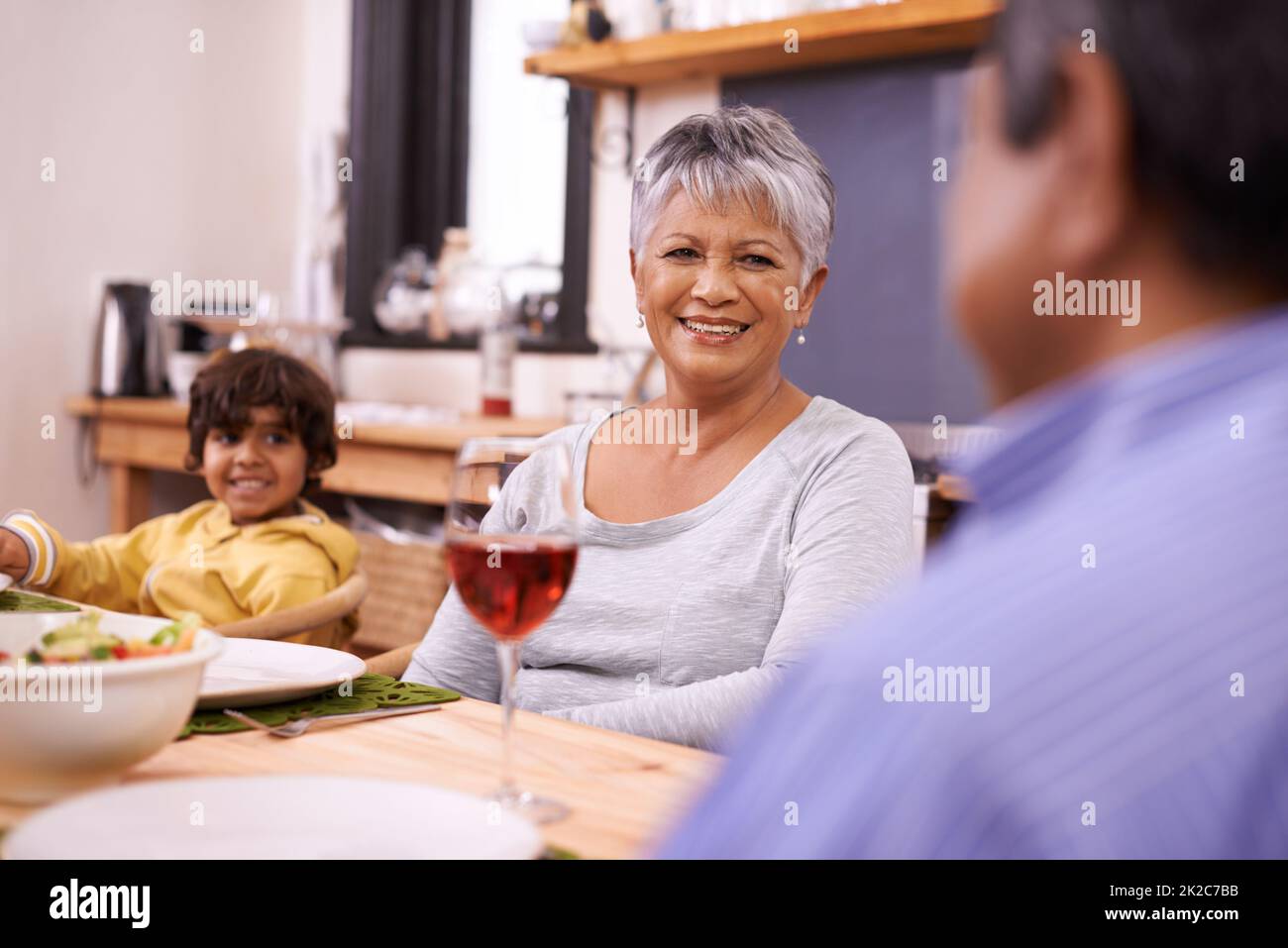 Woman boy eating dinner hi-res stock photography and images - Alamy