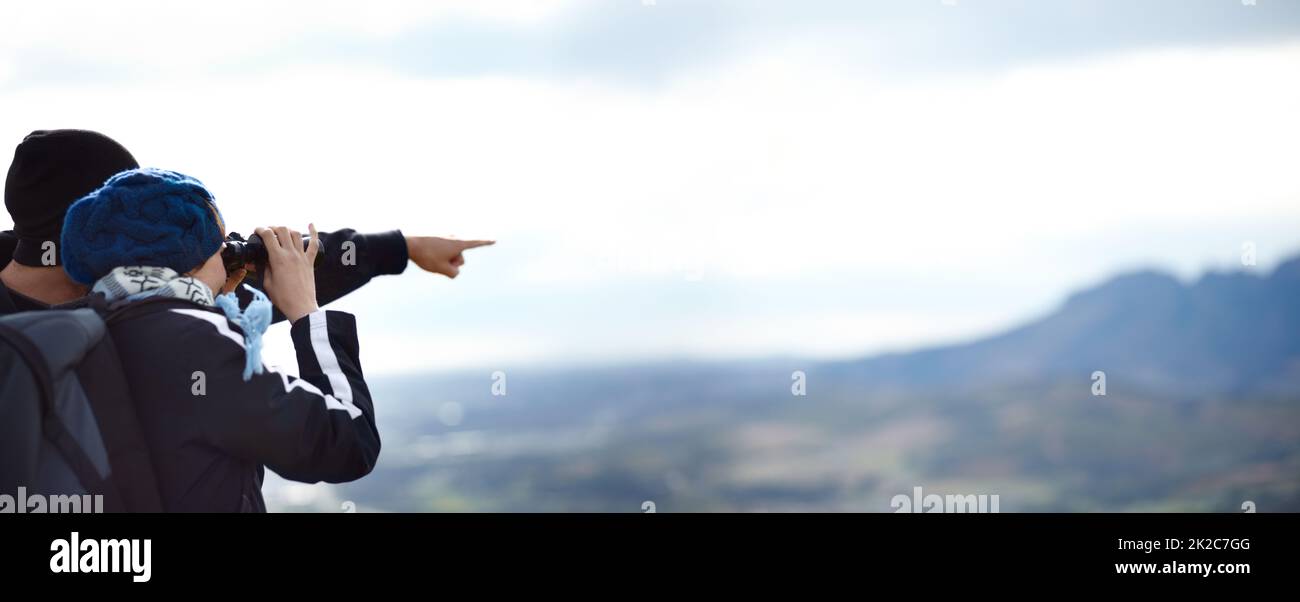 People looking view through binoculars hi-res stock photography and ...