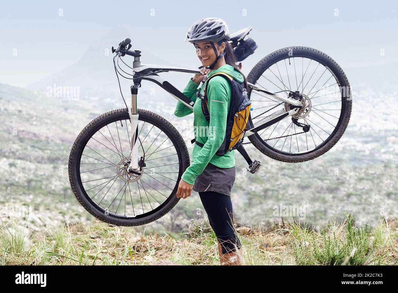 What an exhilarating hobby. A pretty young woman holding her mountain ...