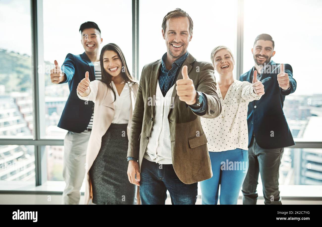 They only work towards success. Portrait of a group of cheerful ...