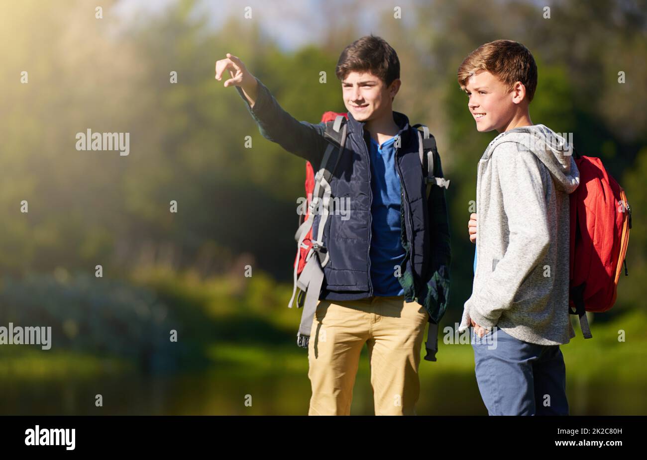 That looks like the perfect camping spot over there. Shot of two young ...