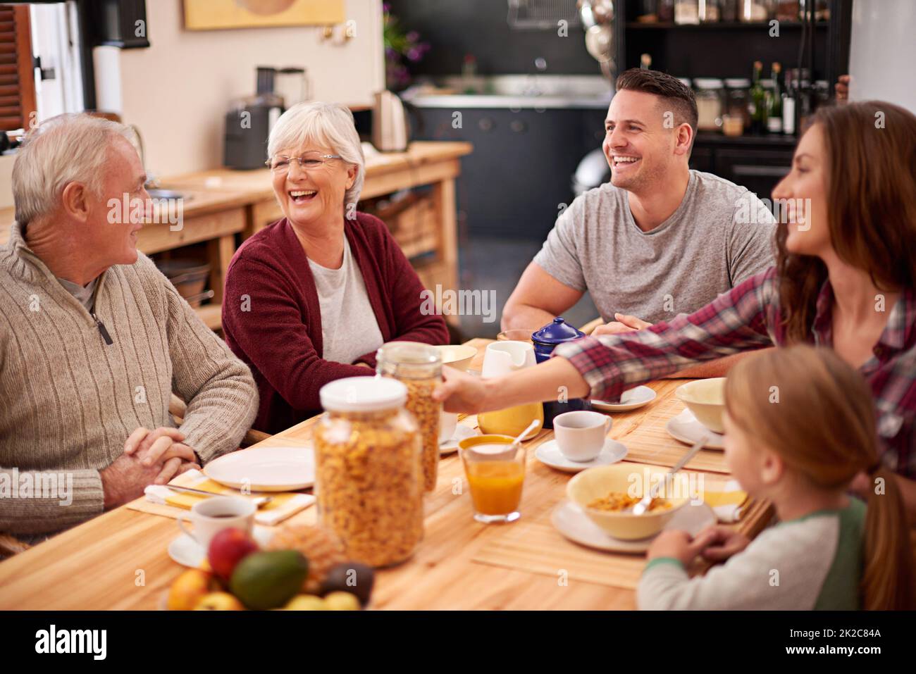 Enjoying a hearty breakfast. Shot of a happy multi-generational family ...