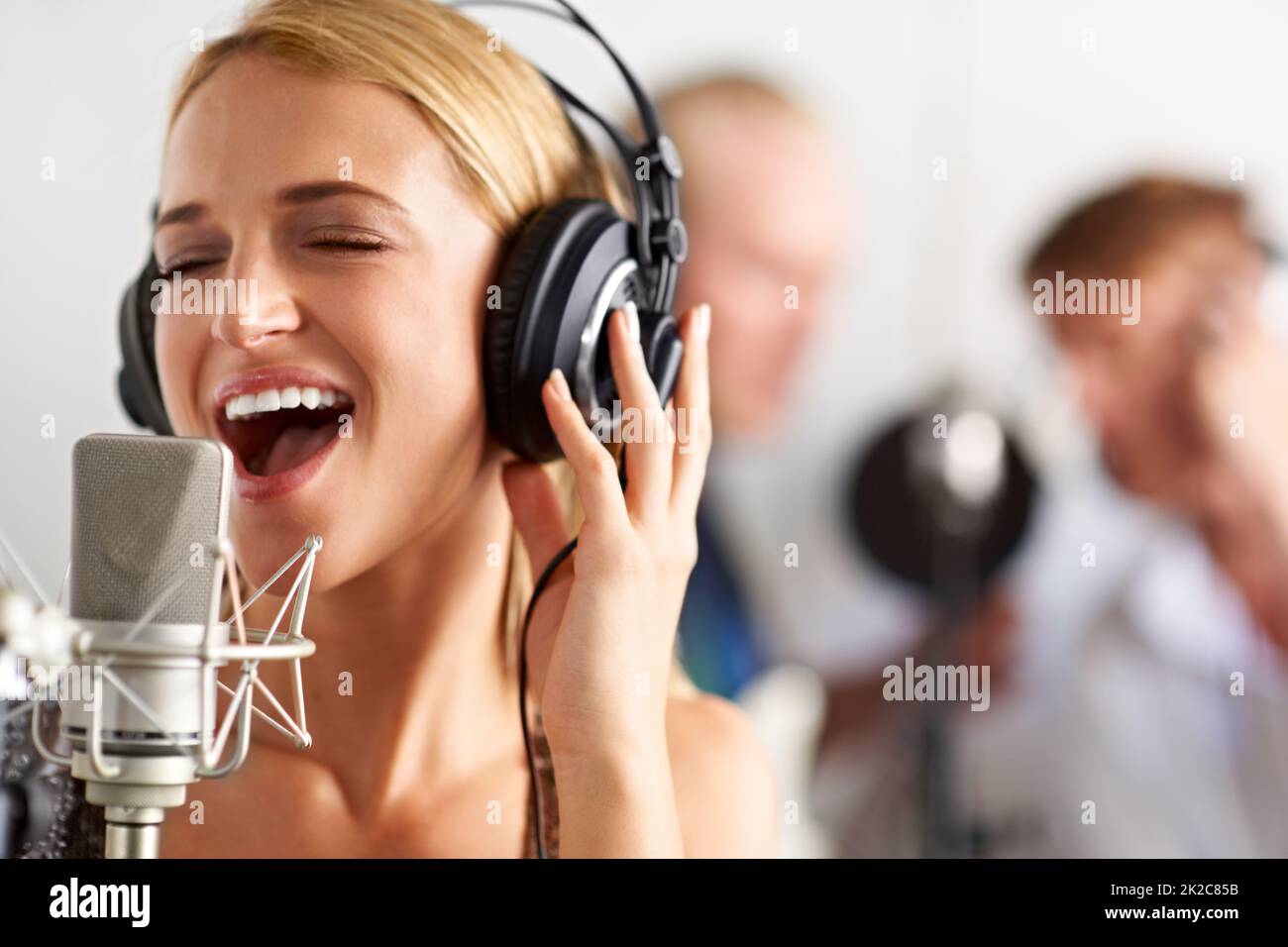 Young woman with microphone hi-res stock photography and images - Alamy