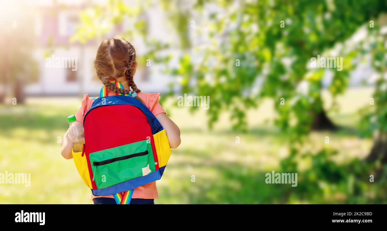 Girl going to study in primary school Stock Photo - Alamy