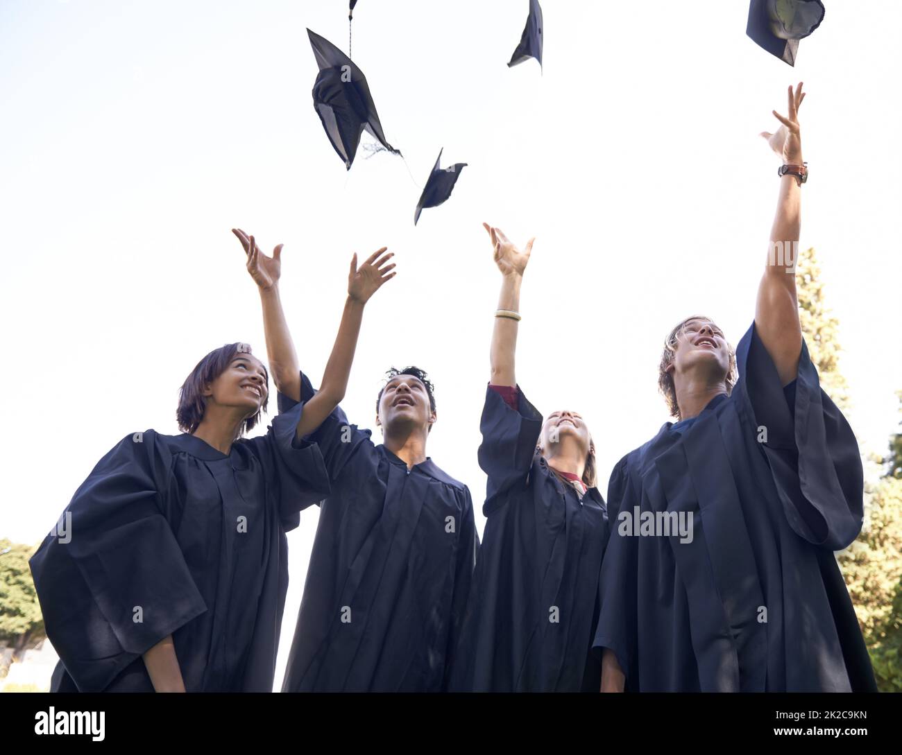 Group happy graduates throwing graduation hi-res stock photography and ...
