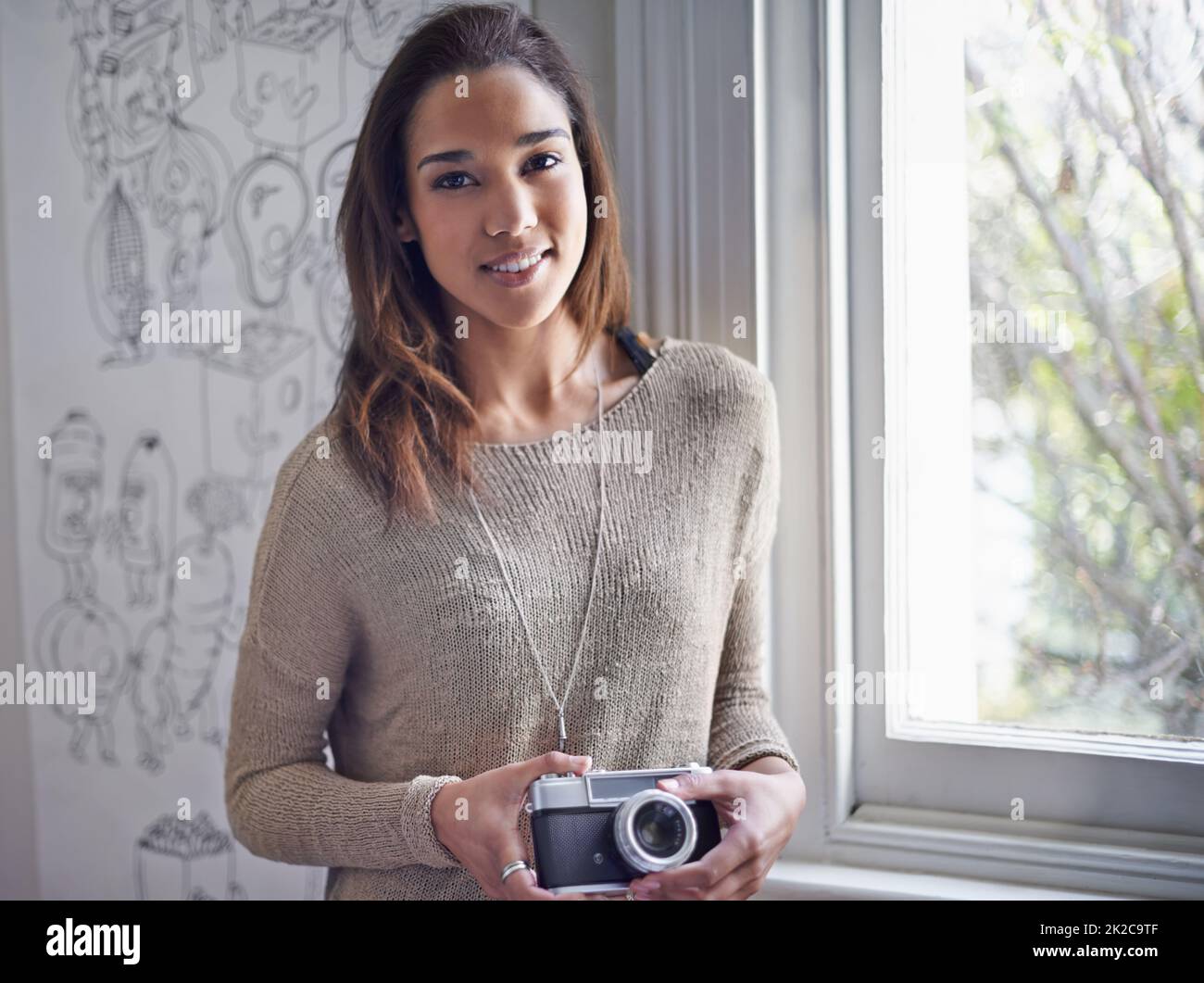 Its what I always dreamt of doing. A young photographer standing near a ...