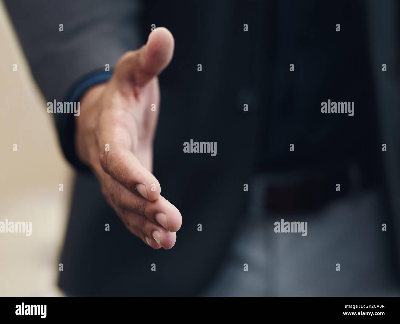 Welcome. Cropped shot of an unrecognizable businessman extending his ...