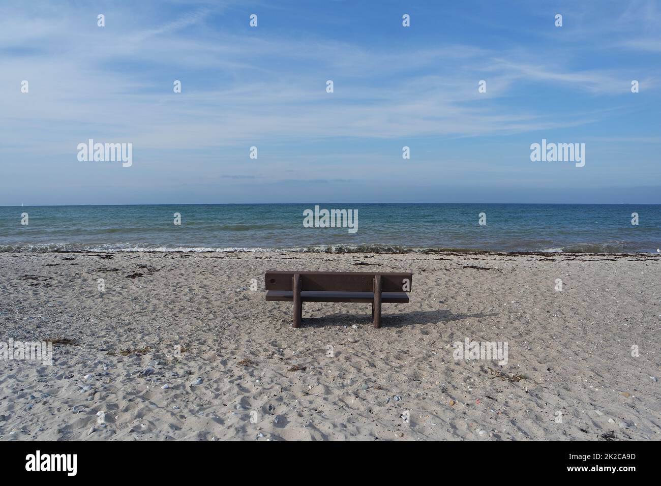 Wooden bench on the beach, Fehmarn Stock Photo - Alamy