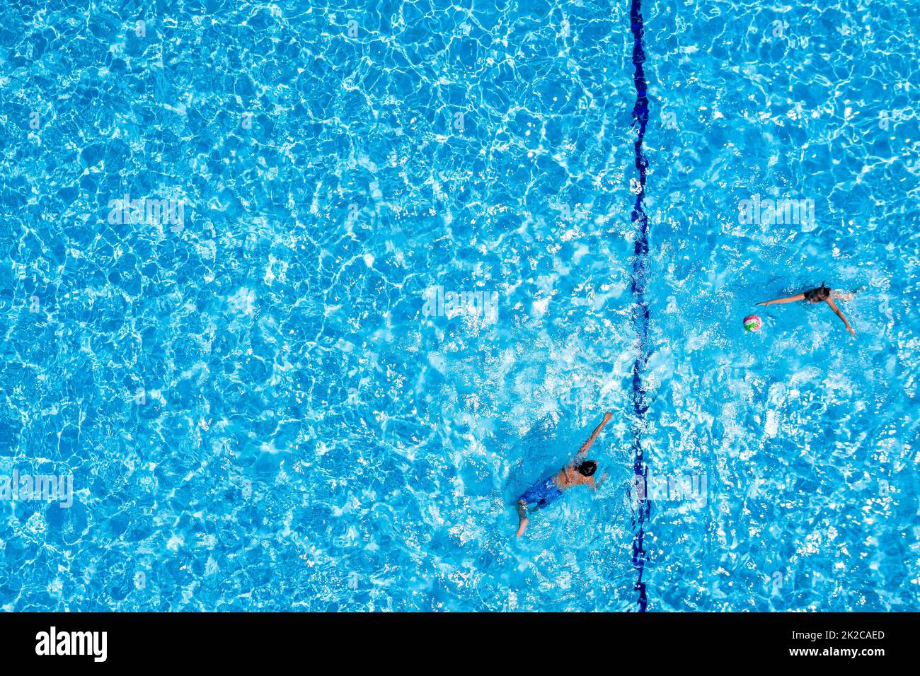 Playing ball swimming pool hi-res stock photography and images - Alamy