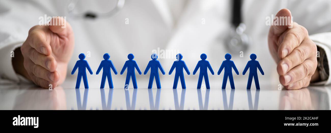 Doctor's Hand Holding Chain Of Human Figure Holding Hand Stock Photo ...