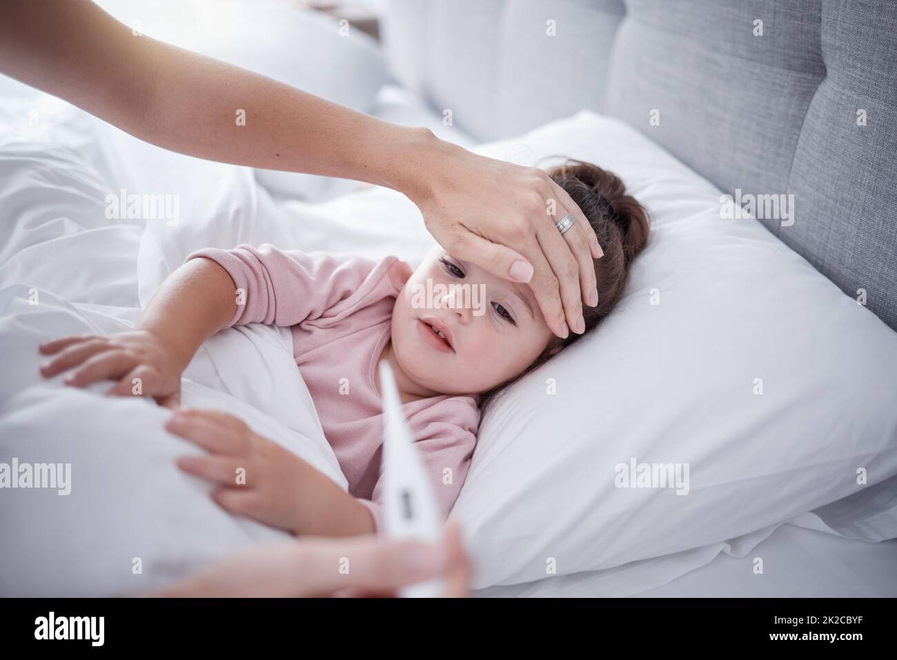 Sick, virus and fever child bedroom with mother feeling hot forehead ...