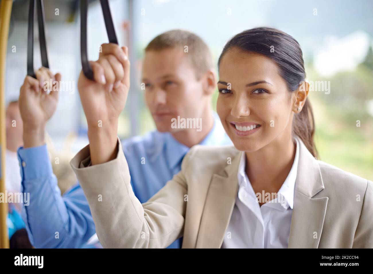 Its better with the bus. Two young colleagues traveling on the bus and ...