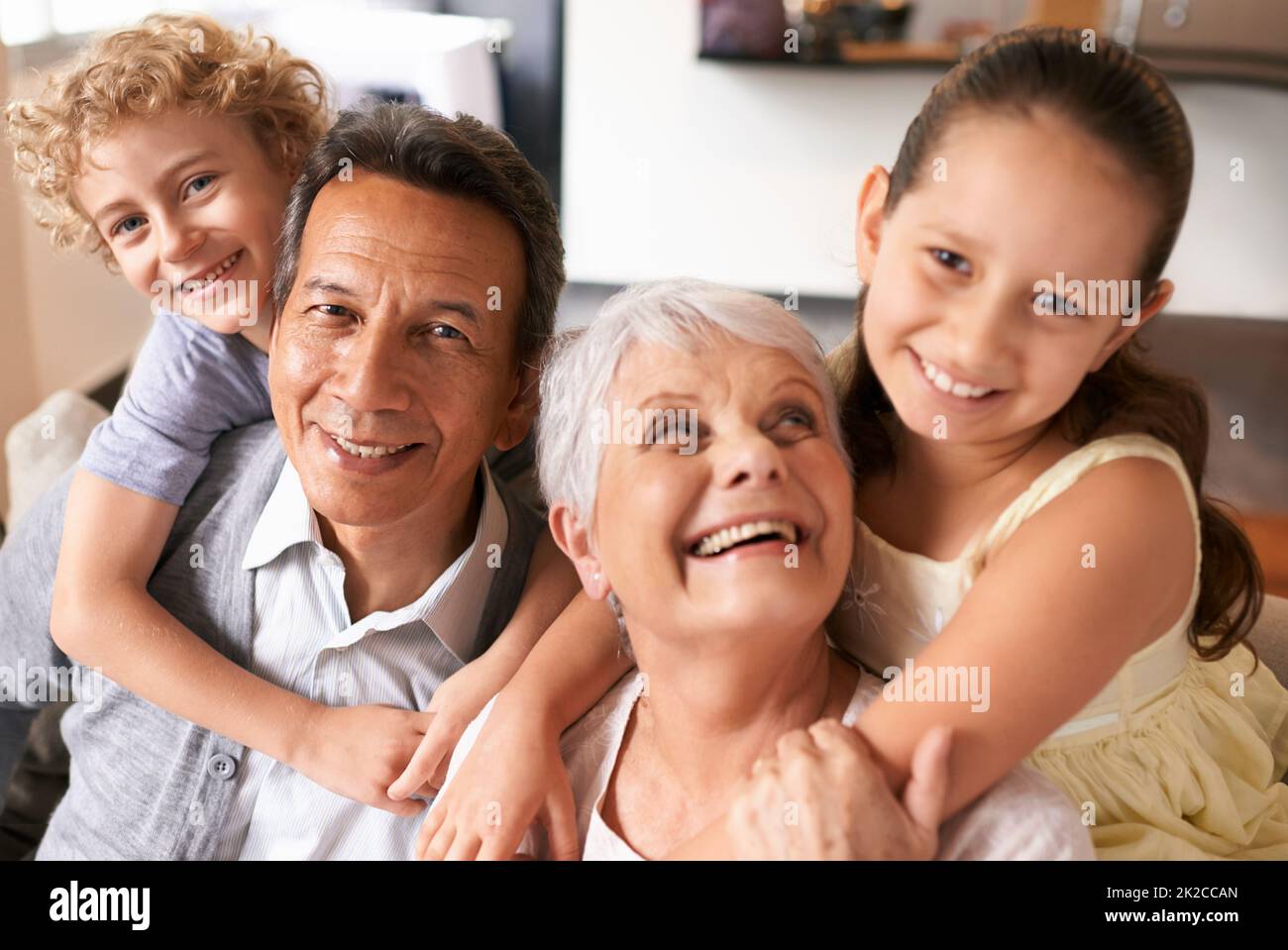 Children with grandparents indoors hi-res stock photography and images ...