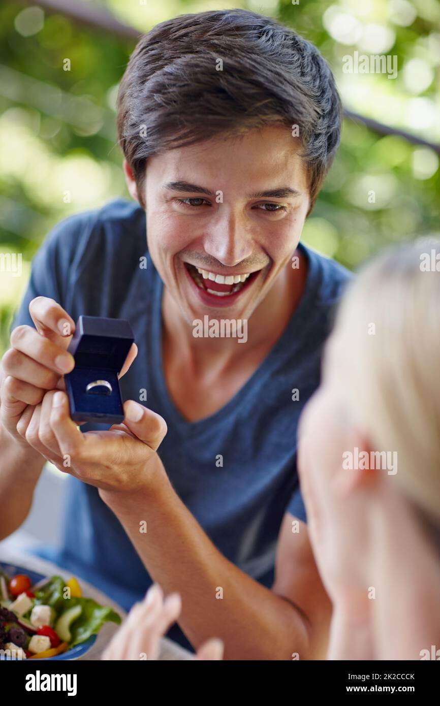 Happy young man sitting balcony hi-res stock photography and images - Alamy