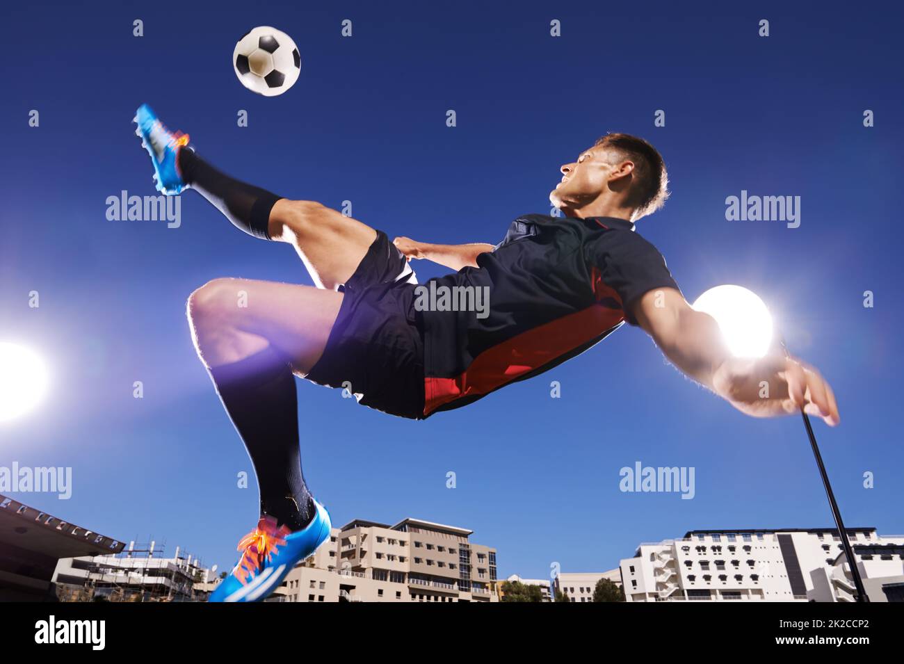 Man kicking ball hi-res stock photography and images - Alamy