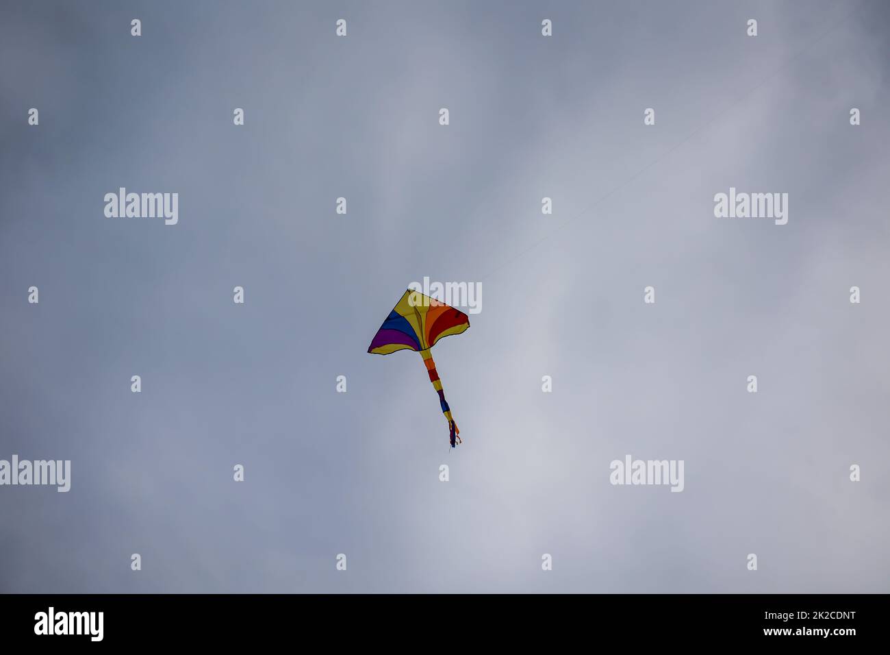 A colorful stunt kite, kite with colorful tail in the sky Stock Photo ...