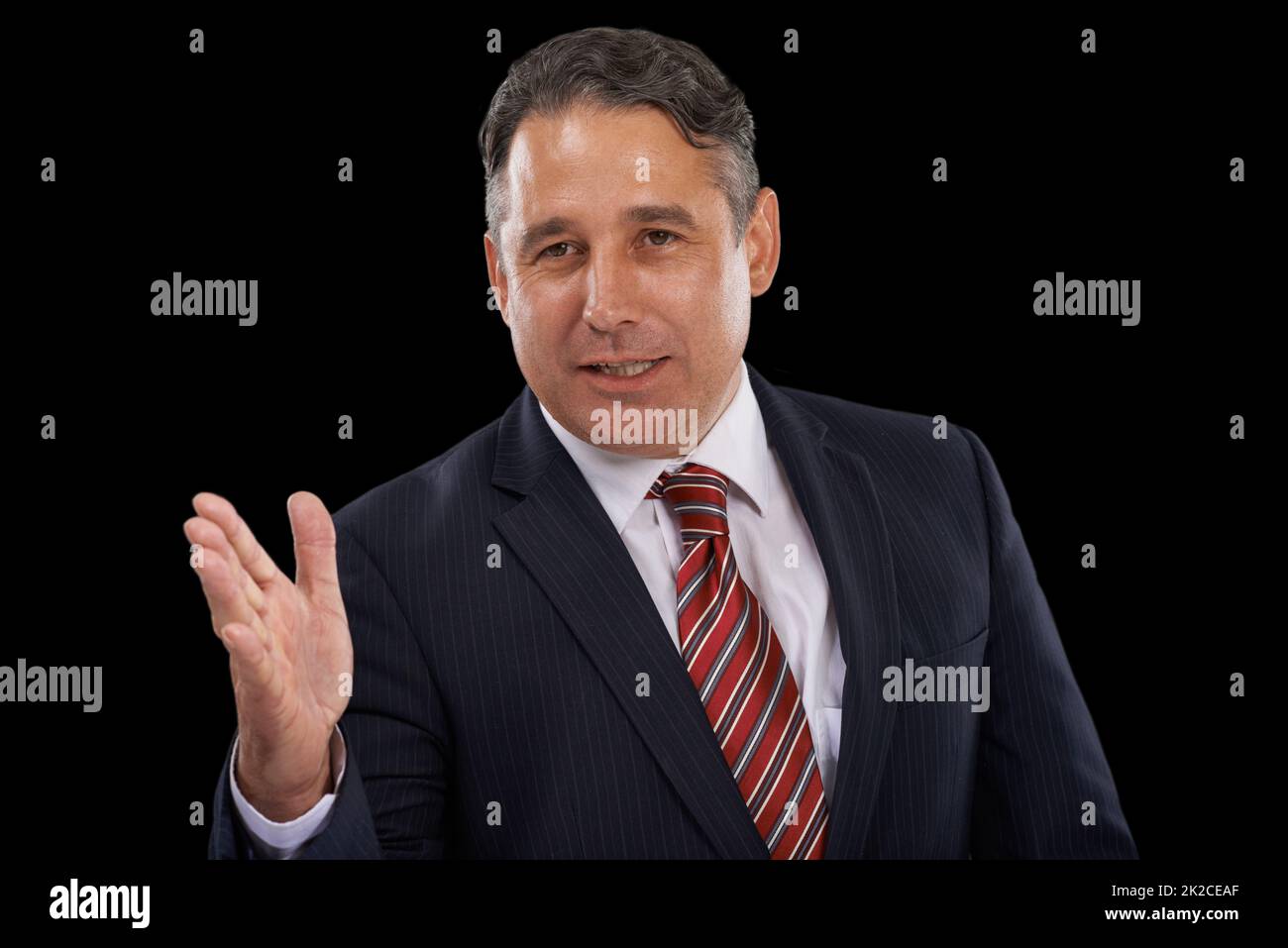 He Has Firm Beliefs A Serious Man In A Suit Gesturing With His Hand