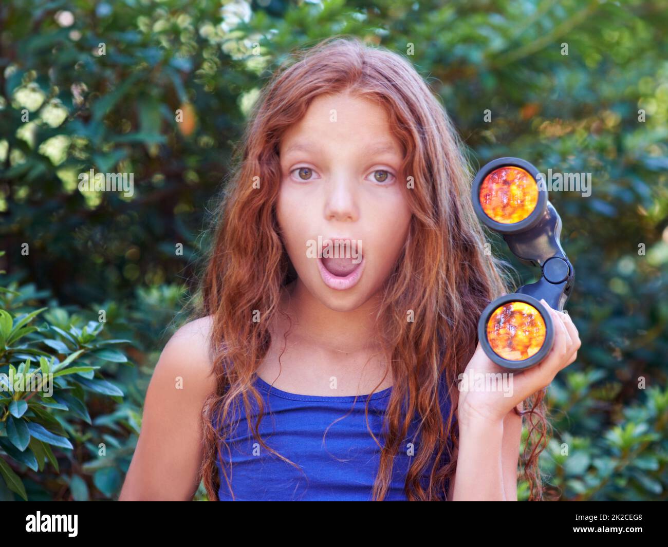 Getting a closer look at nature. A young child holding binoculars Stock ... Getting a closer look at nature. A young child holding binoculars Stock ...