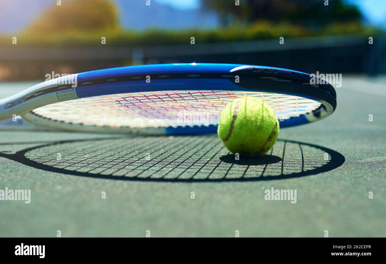 Tennis ball on racket hi-res stock photography and images - Alamy