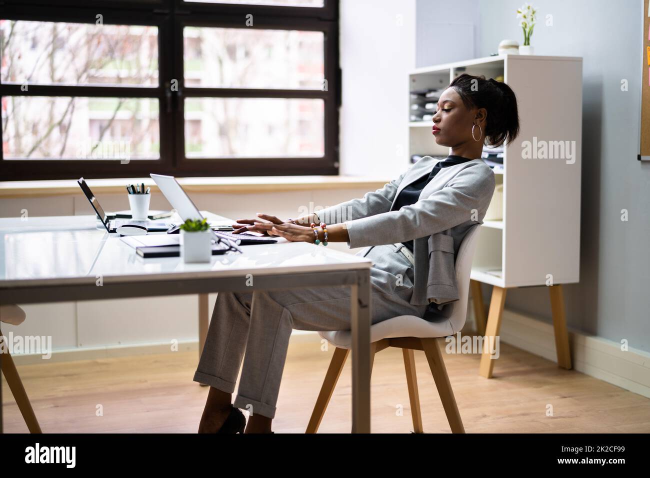 Bad Posture African American Woman Working Stock Photo - Alamy