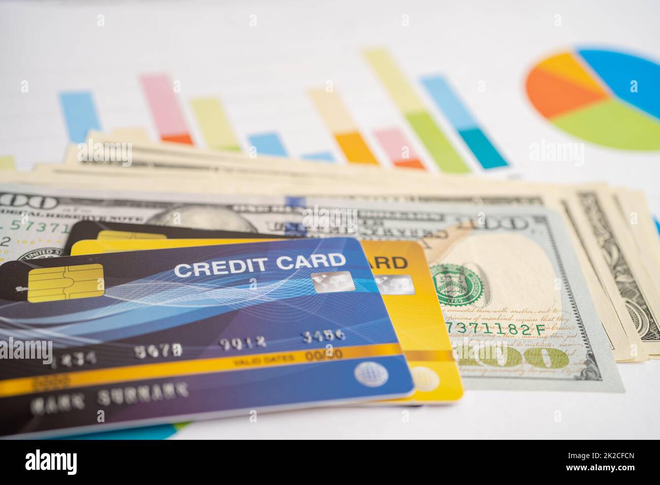 Credit card on chart and graph paper. Finance development, Banking ...