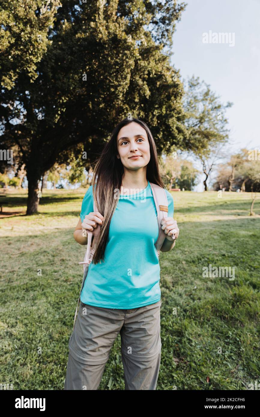 Looking to the future. Young university student girl wearing aquamarina ...