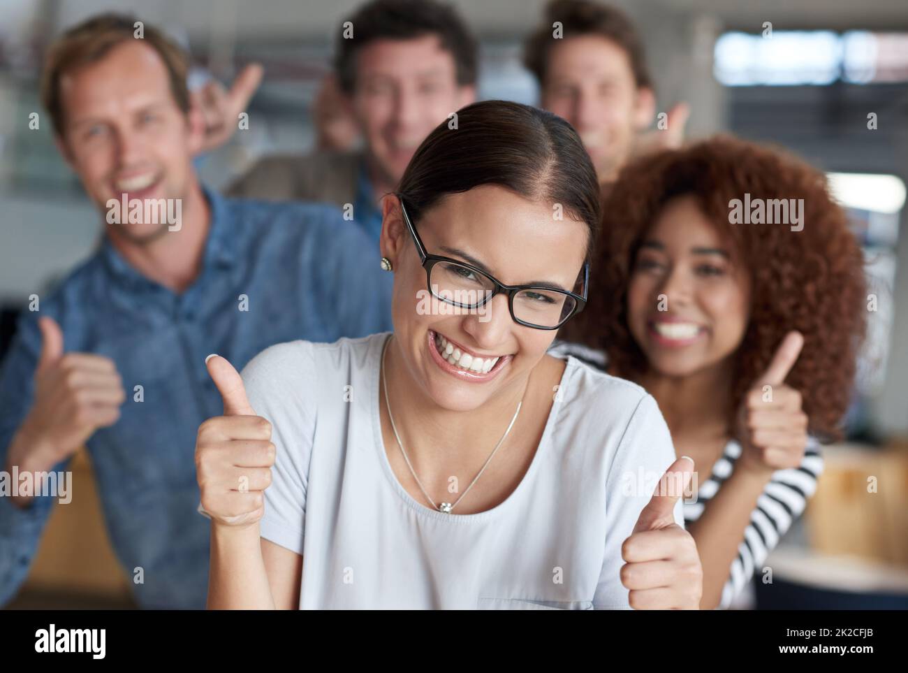 Group people looking camera thumbs up hi-res stock photography and ...
