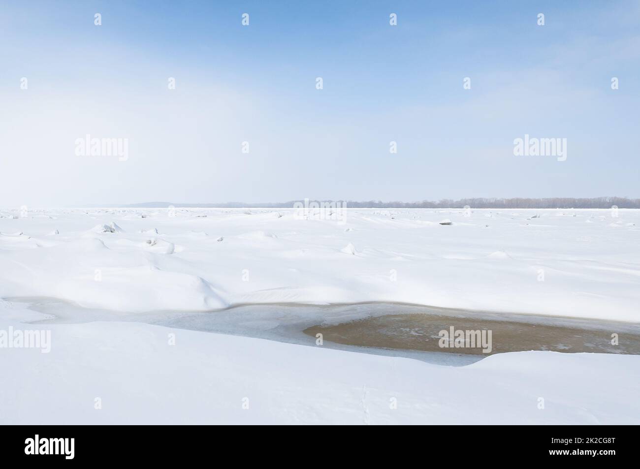 Stunning view of the frozen river covered with chunks of ice and white ...
