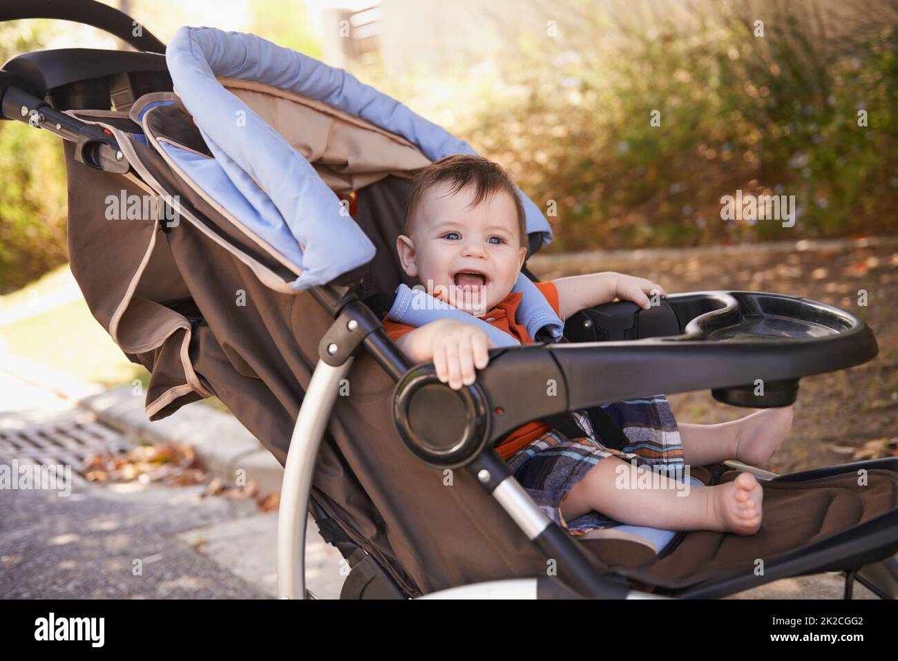 Roadtrip time. Portrait of a baby boy sitting in a stroller Stock Photo ...