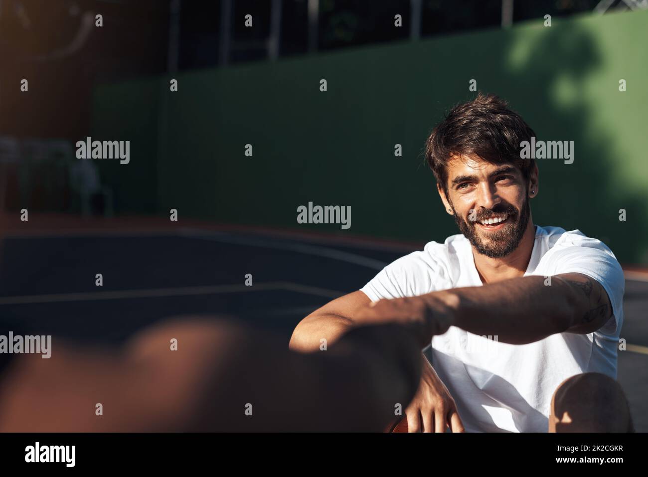 See you tomorrow, same time same place. Shot of a sporty young man ...