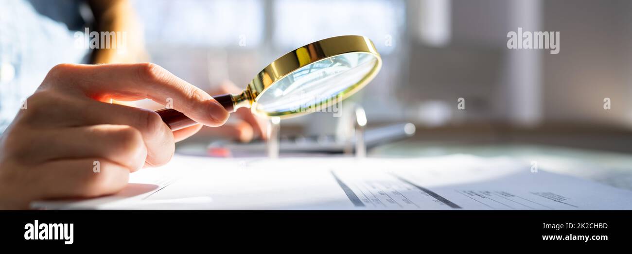 Auditor Using Magnifying Glass For Audit Stock Photo - Alamy