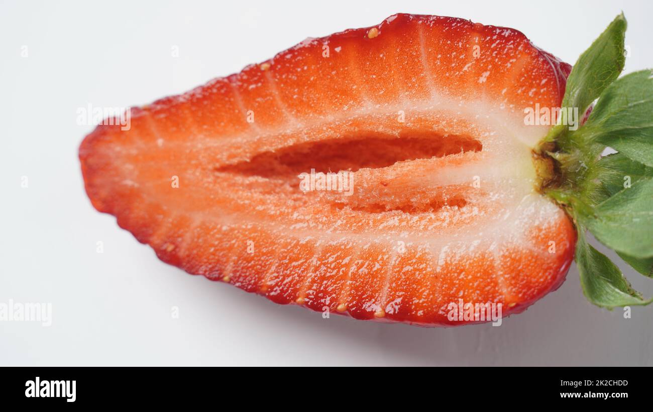 Sweet fresh strawberry half cut on white background Stock Photo - Alamy