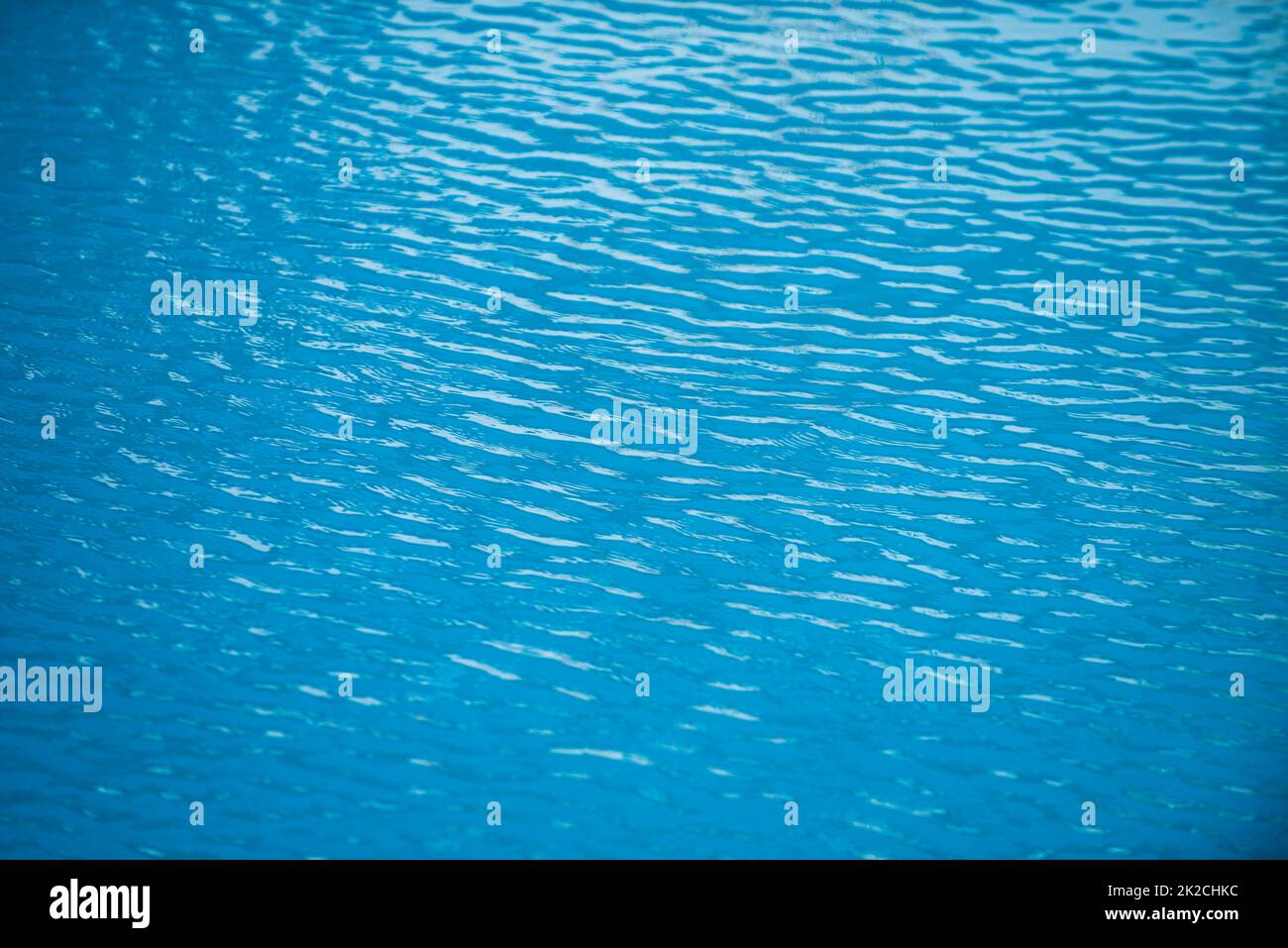Water background. Blue water, ripples and highlights. Texture of water ...