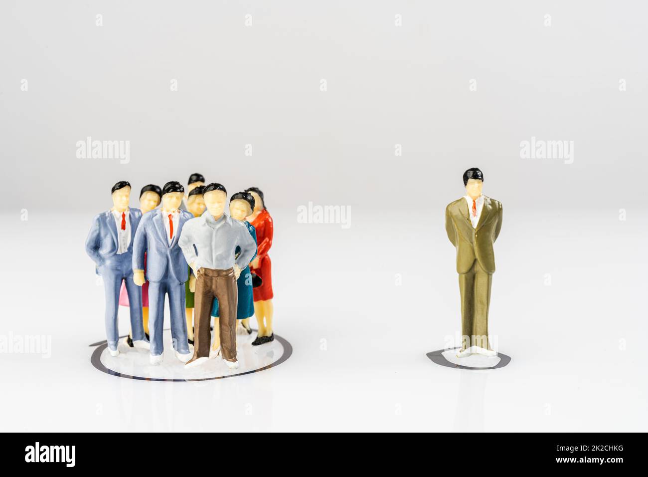 isolated group of people and a single man miniature models Stock Photo ...