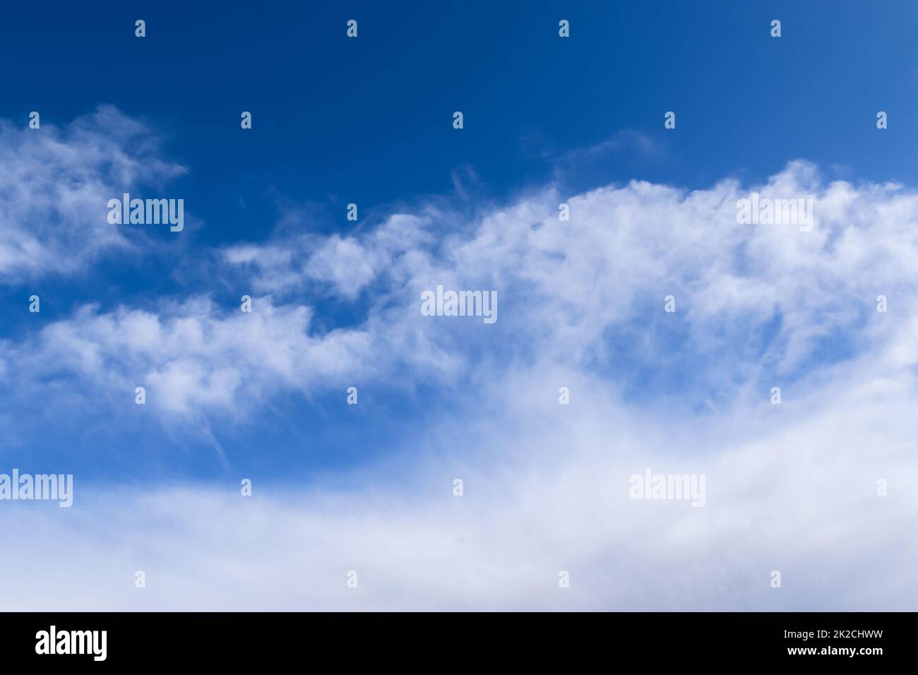 Stunning cirrus cloud formation panorama in a deep blue sky Stock Photo ...