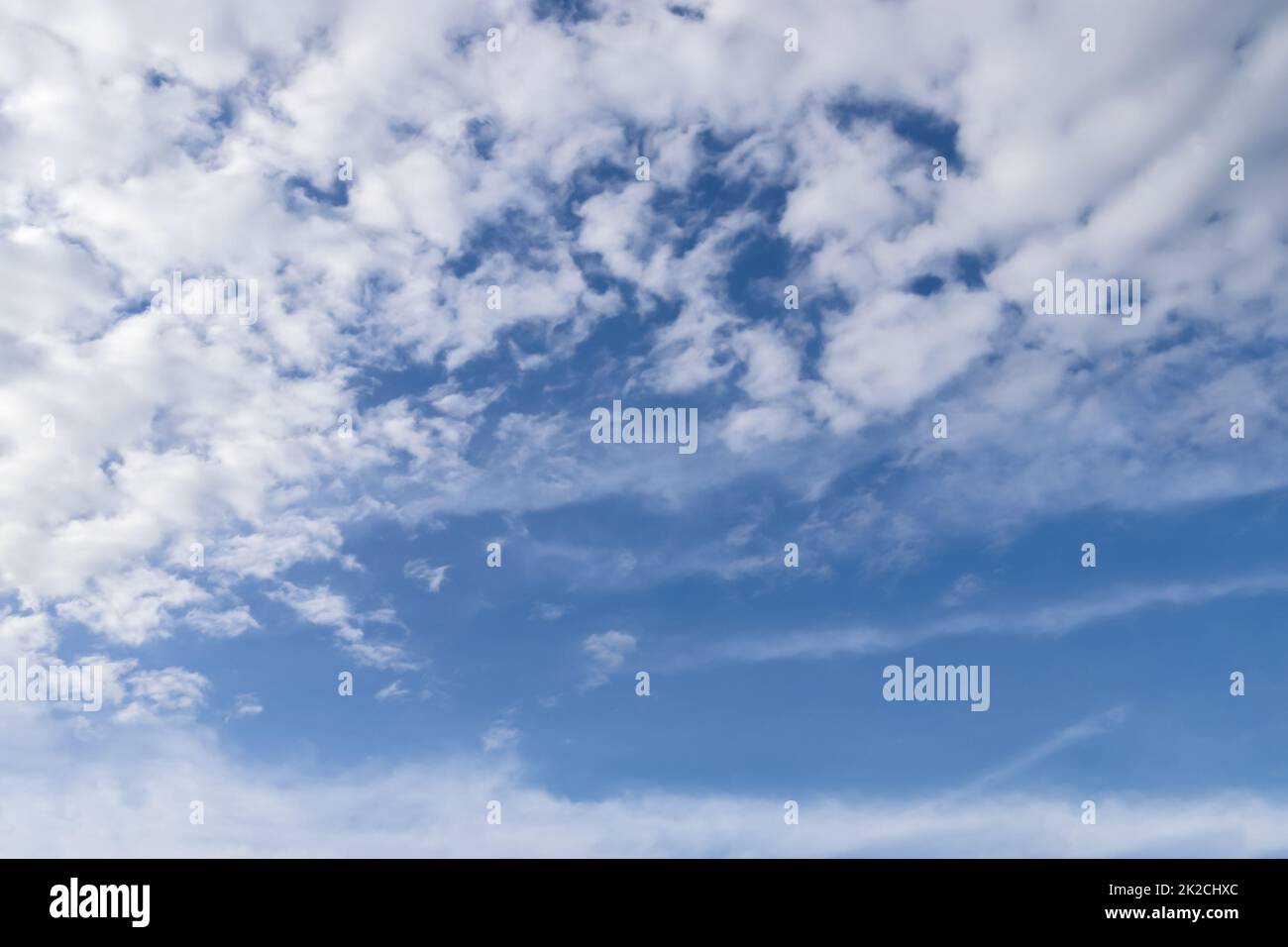 Stunning cirrus cloud formation panorama in a deep blue sky Stock Photo ...