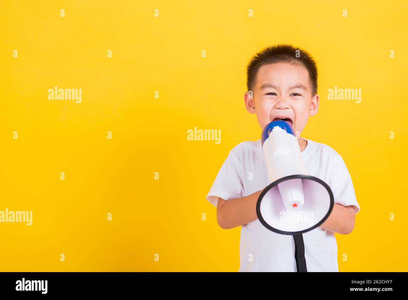 child boy holding and shouting or screaming through the megaphone Stock ...