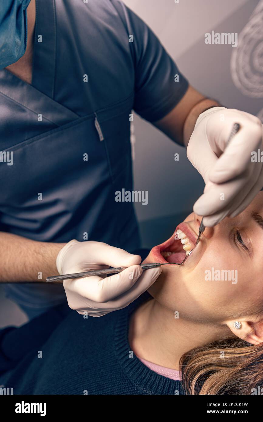 Dentist using professional equipment hi-res stock photography and ...