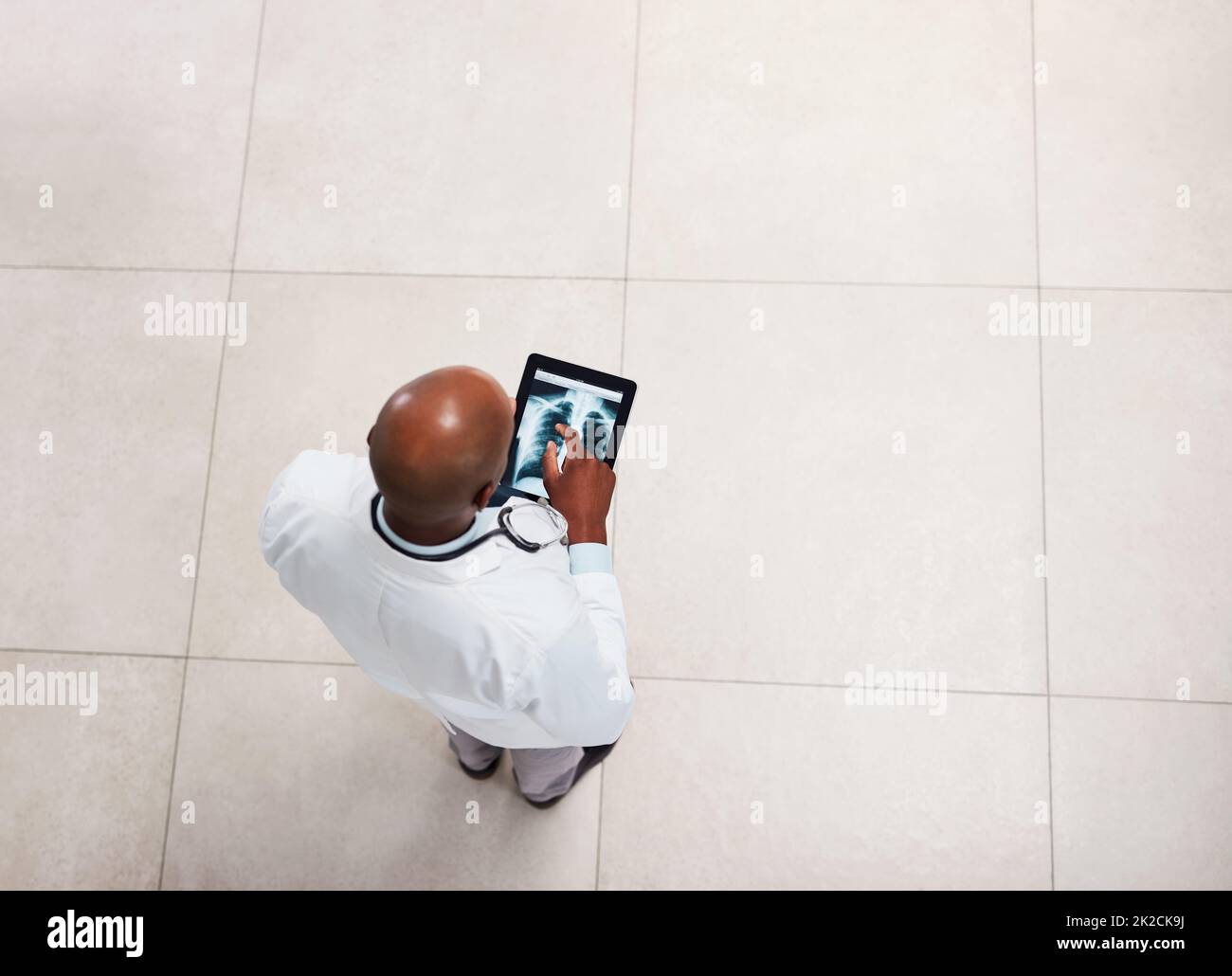 He pays attention to detail. High angle shot of a young doctor working ...