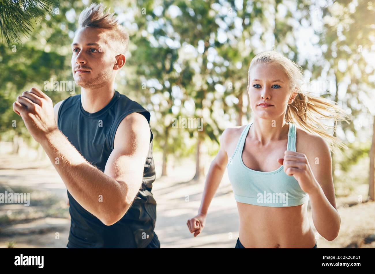 Two young women running in a forest hi-res stock photography and images ...
