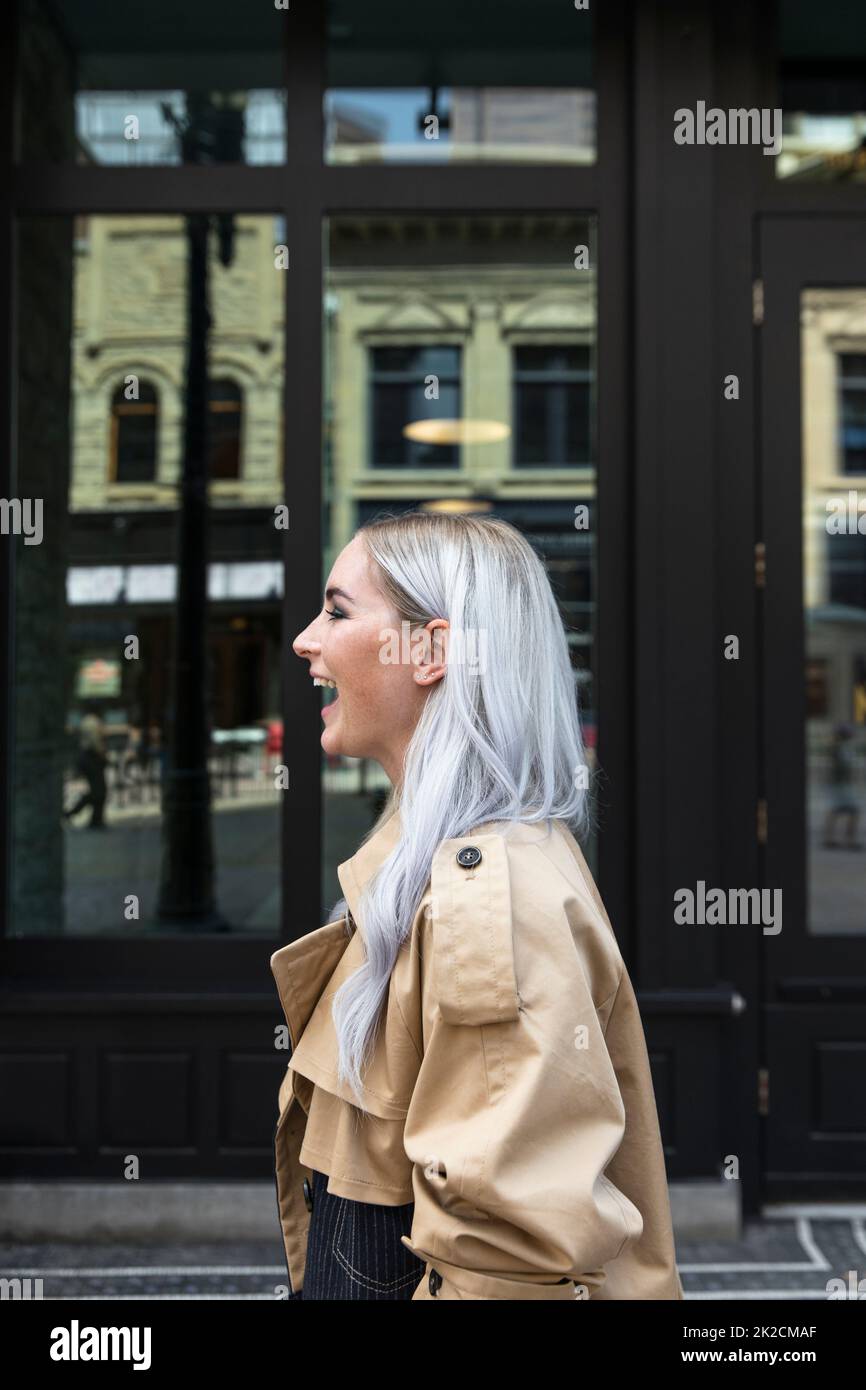Woman walking outside building hi-res stock photography and images - Alamy