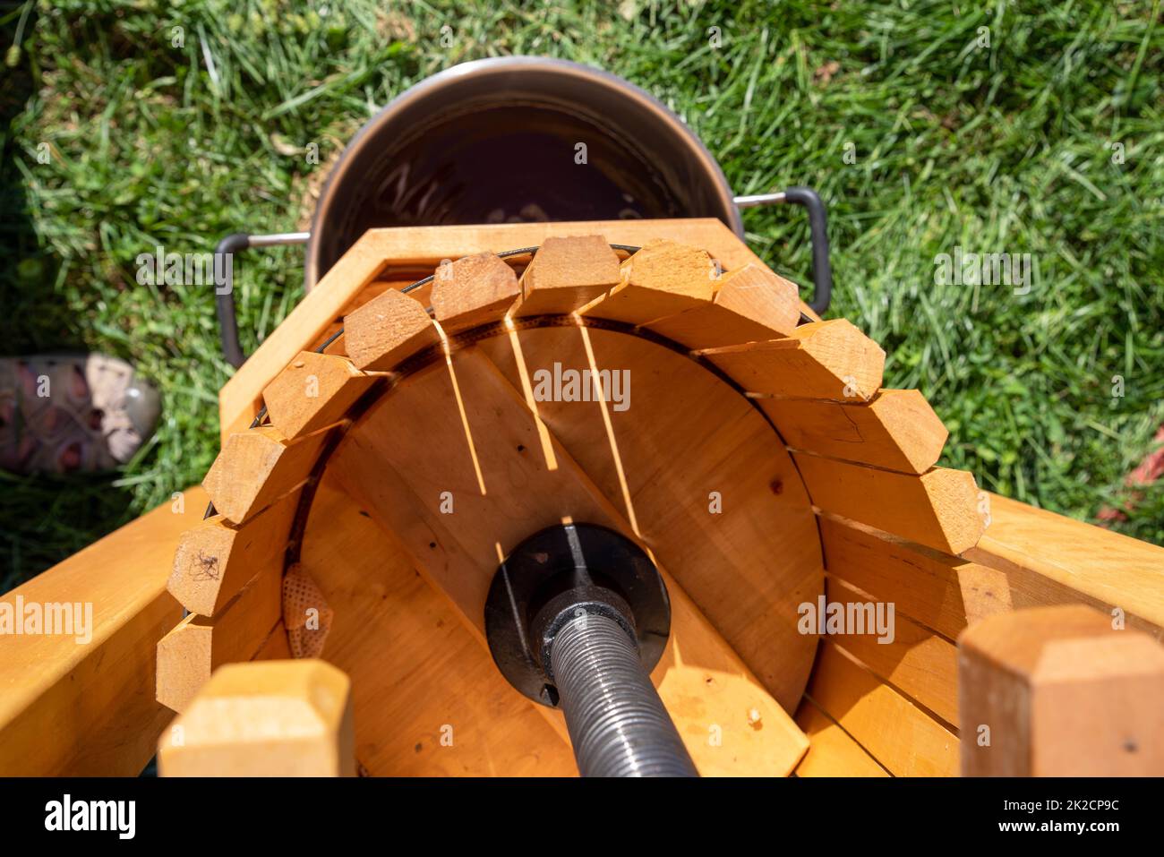 Close up high angle view of apple cider press Stock Photo - Alamy