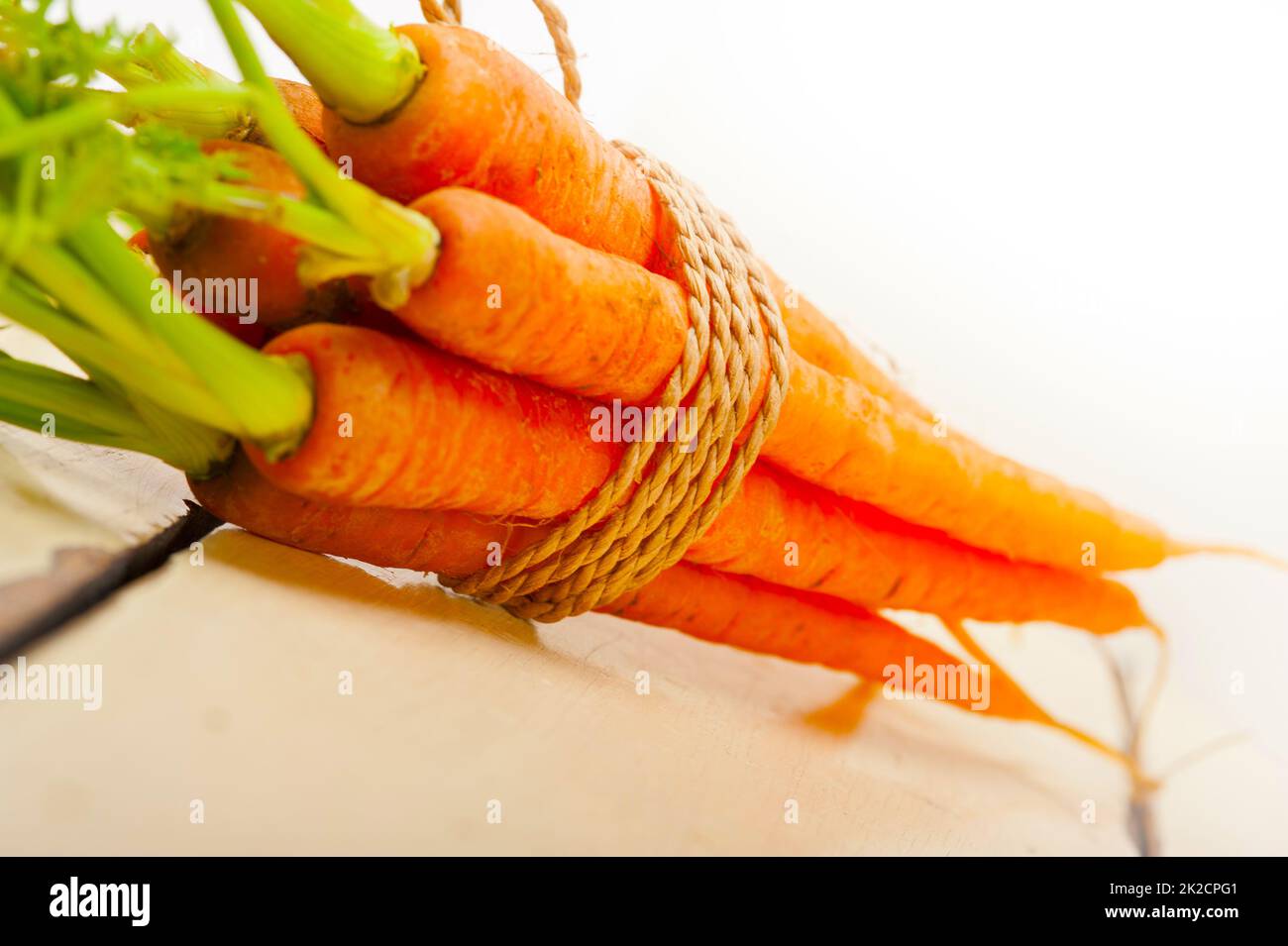 baby carrots bunch tied with rope Stock Photo - Alamy