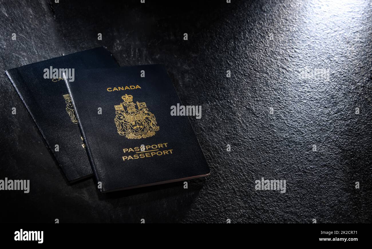 Composition with two Canadian passports Stock Photo - Alamy