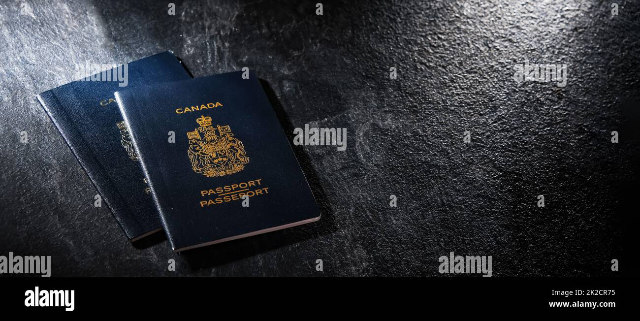 Composition with two Canadian passports Stock Photo - Alamy