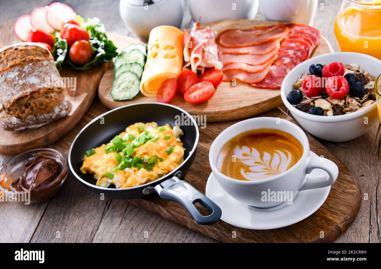 Breakfast served with coffee, scrambled eggs, cereals and ham Stock ...