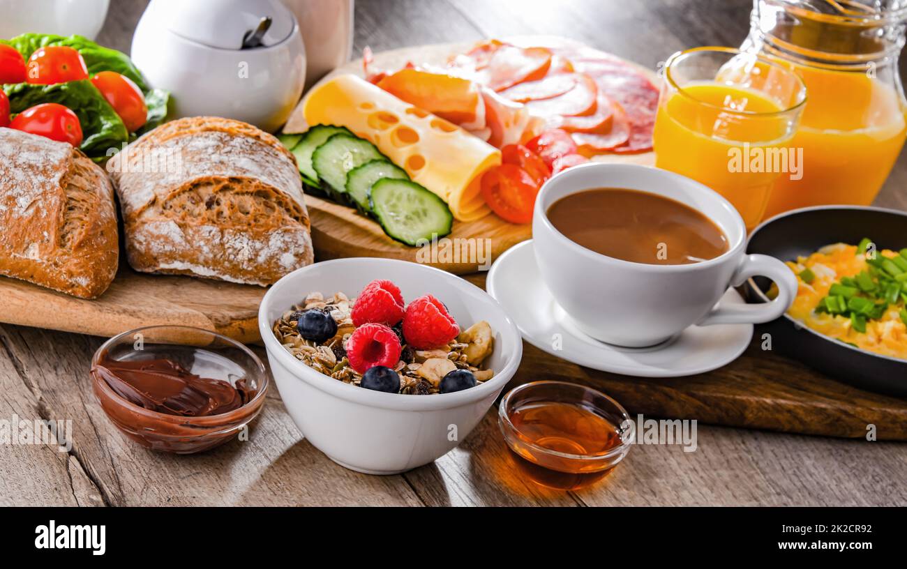 Breakfast served with coffee, scrambled eggs, cereals and ham Stock ...