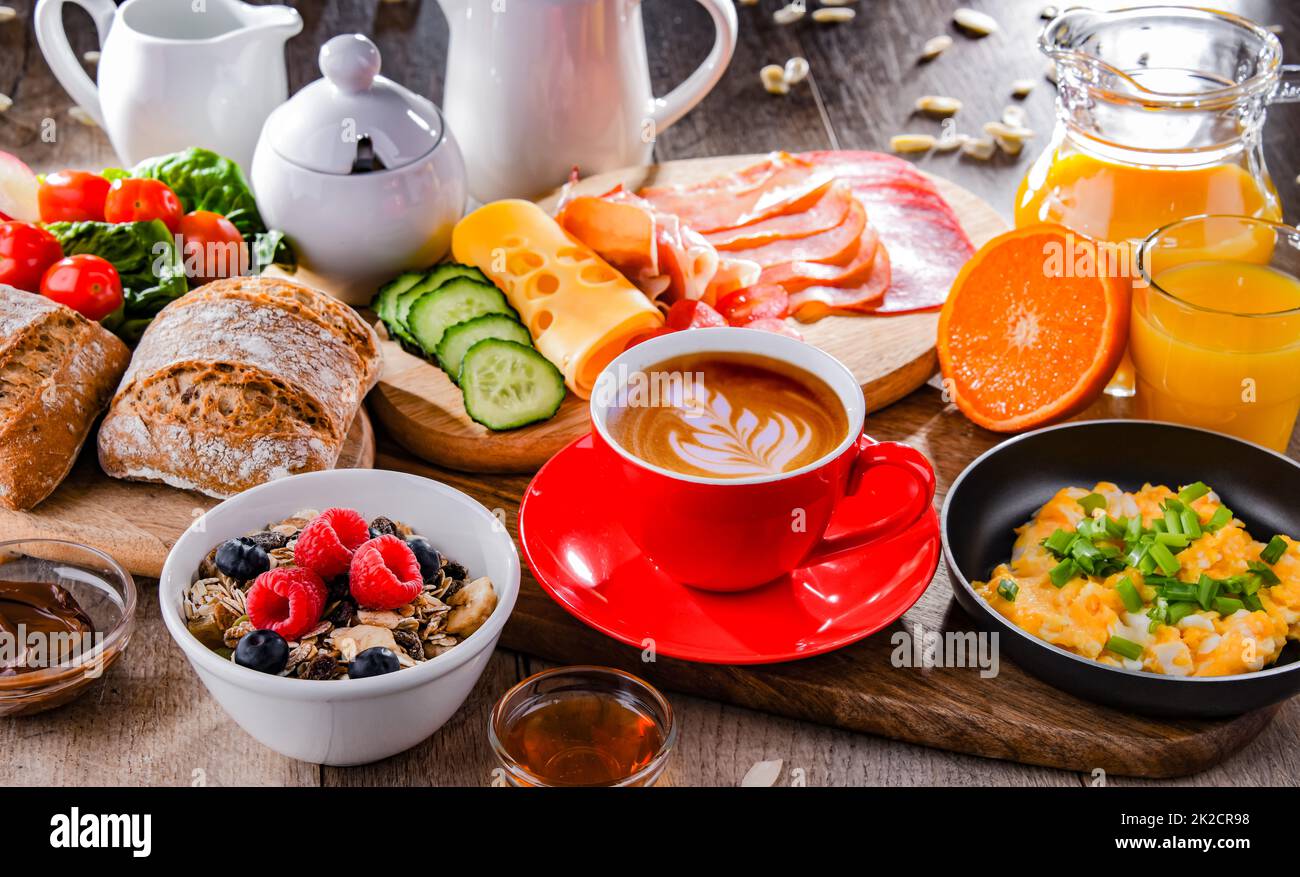 Breakfast served with coffee, scrambled eggs, cereals and ham Stock ...